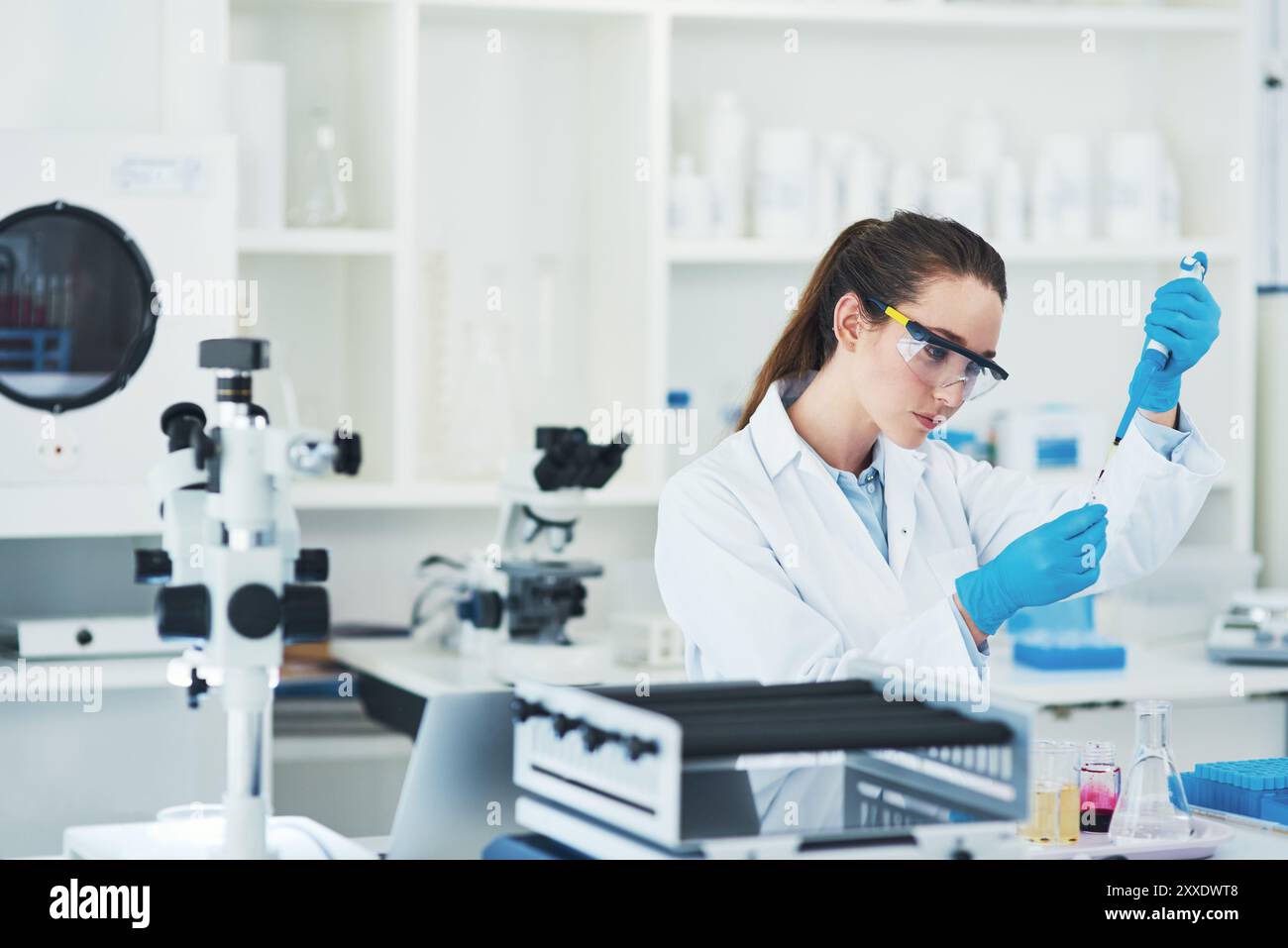 Woman, science and chemicals on pipette or test tube for medical ...