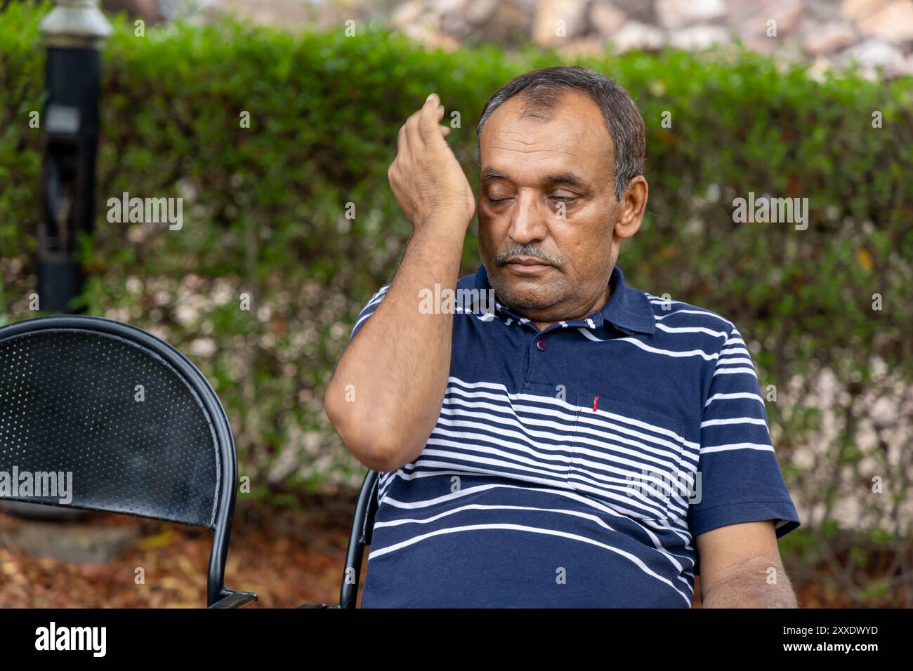isolated alone man in depression sitting at outdoor park at evening ...