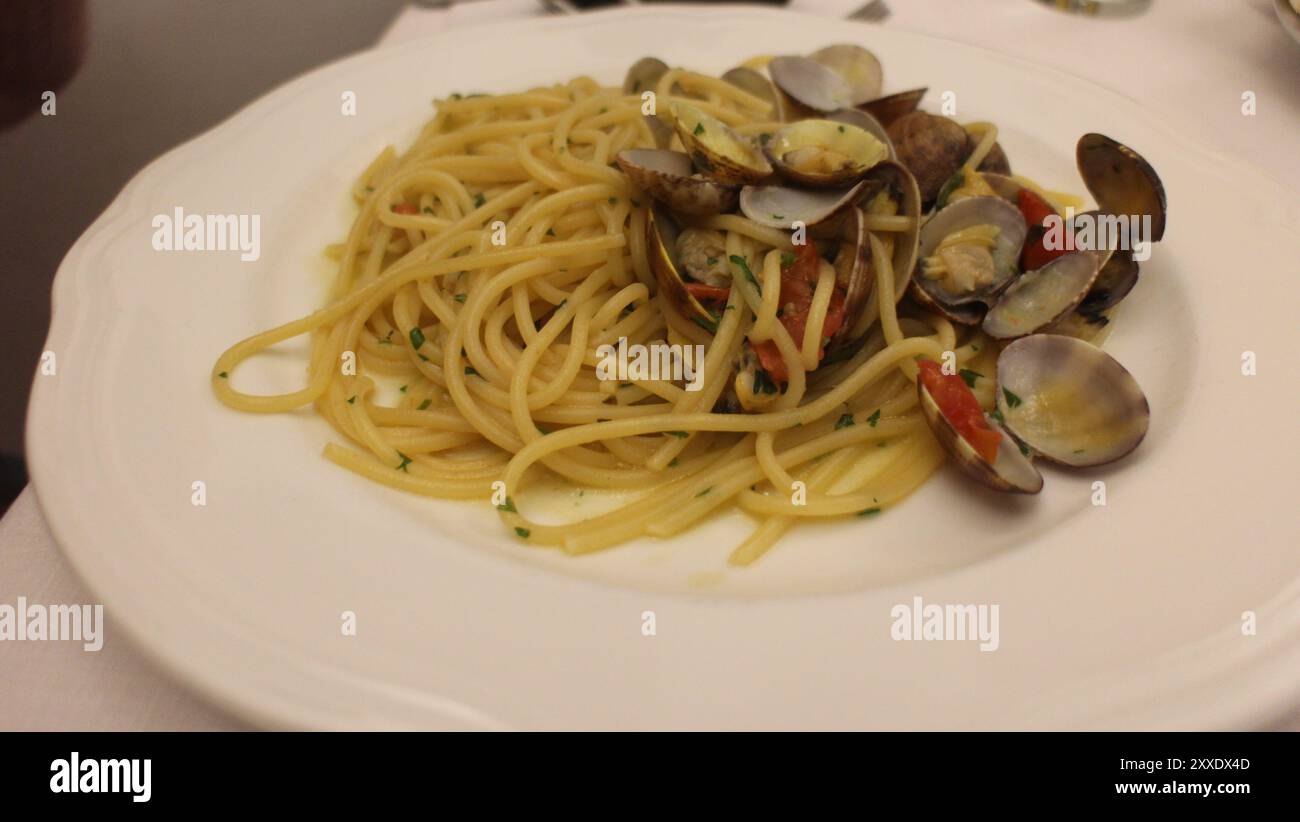 Italian cuisine: spaghetti alle vongole in Amalfi, Italy Stock Photo ...