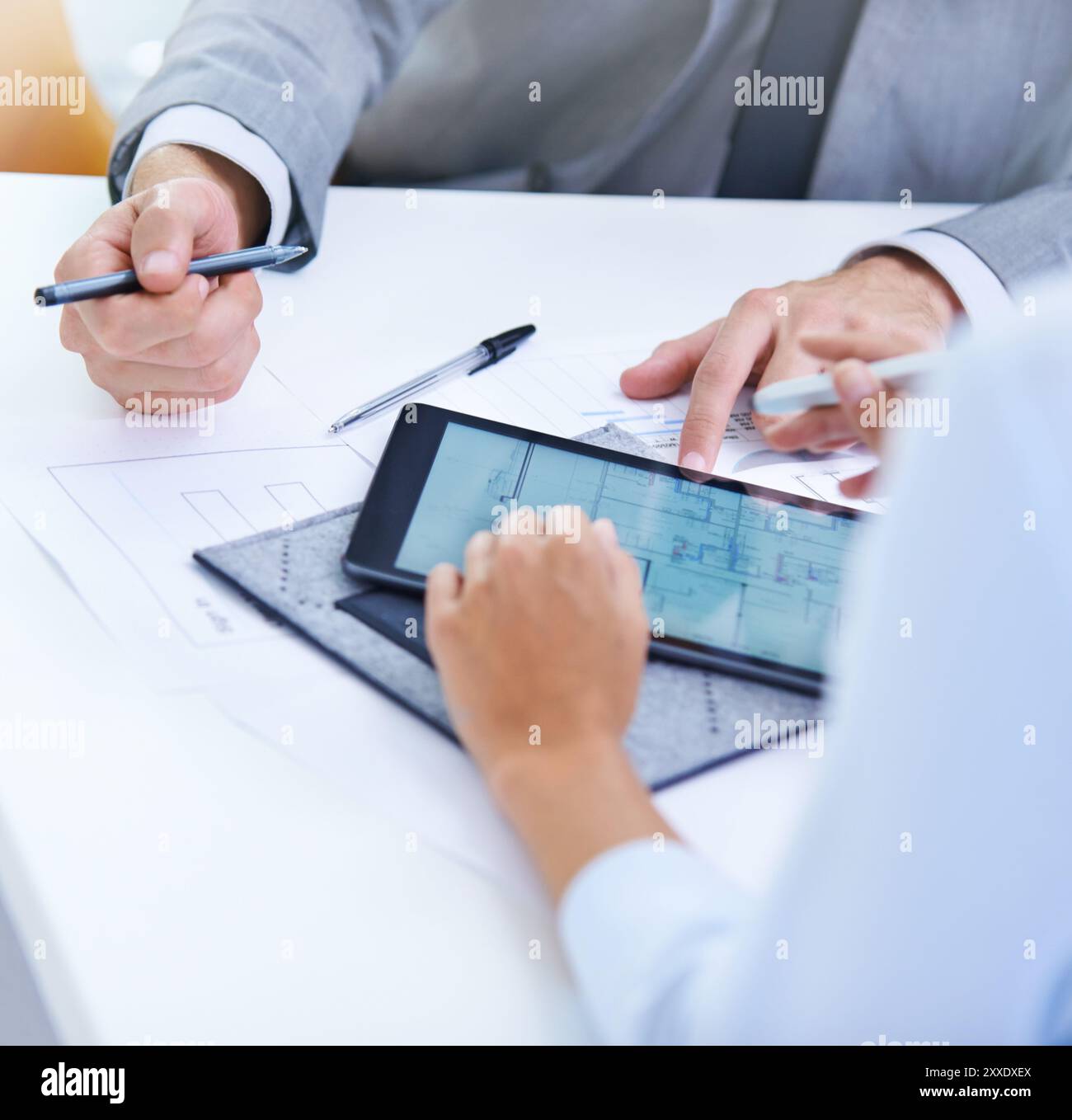 Tablet, floor plan screen or hands of people planning in meeting for ...