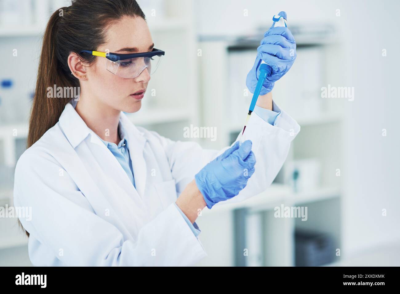 Science, research and woman with vial in laboratory for medical ...