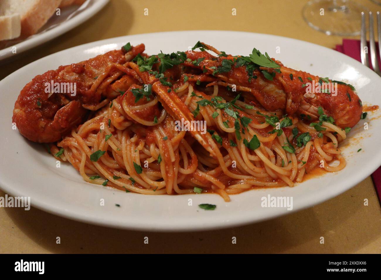 Italian cuisine: spaghetti with prawns and tomato sauce in Venice ...