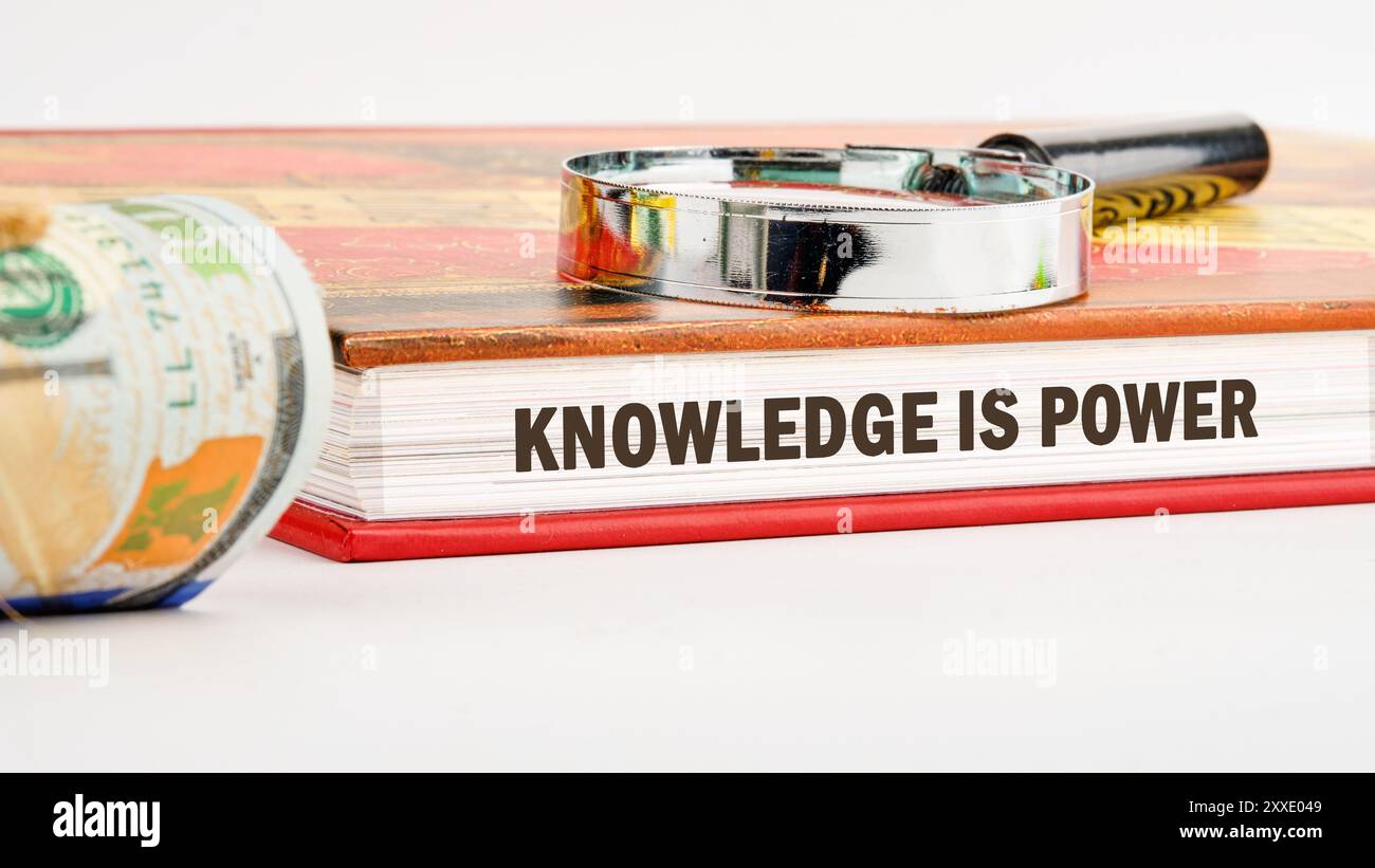 KNOWLEDGE IS POWER words on the end of the book on a white background ...
