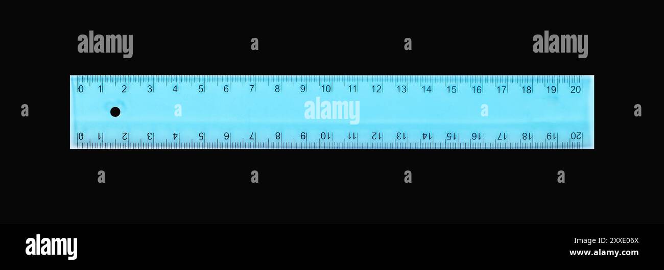 Science and education - Plastic blue school ruler isolated on a black ...