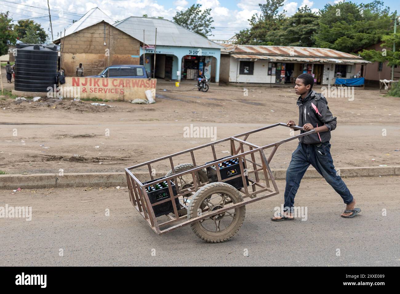Pushing cart barrow hi-res stock photography and images - Alamy