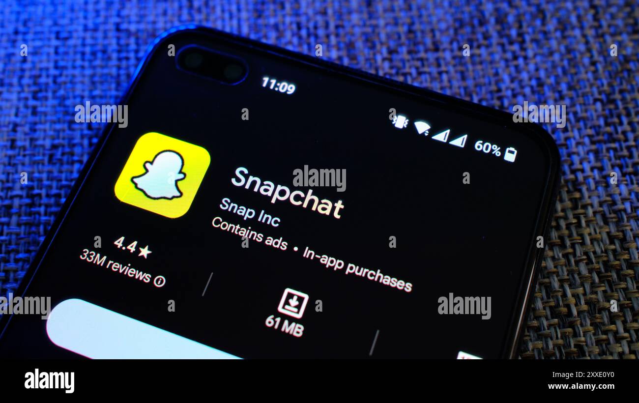 Snapchat app in play store page on mobile phone display. London, UK, 08 ...