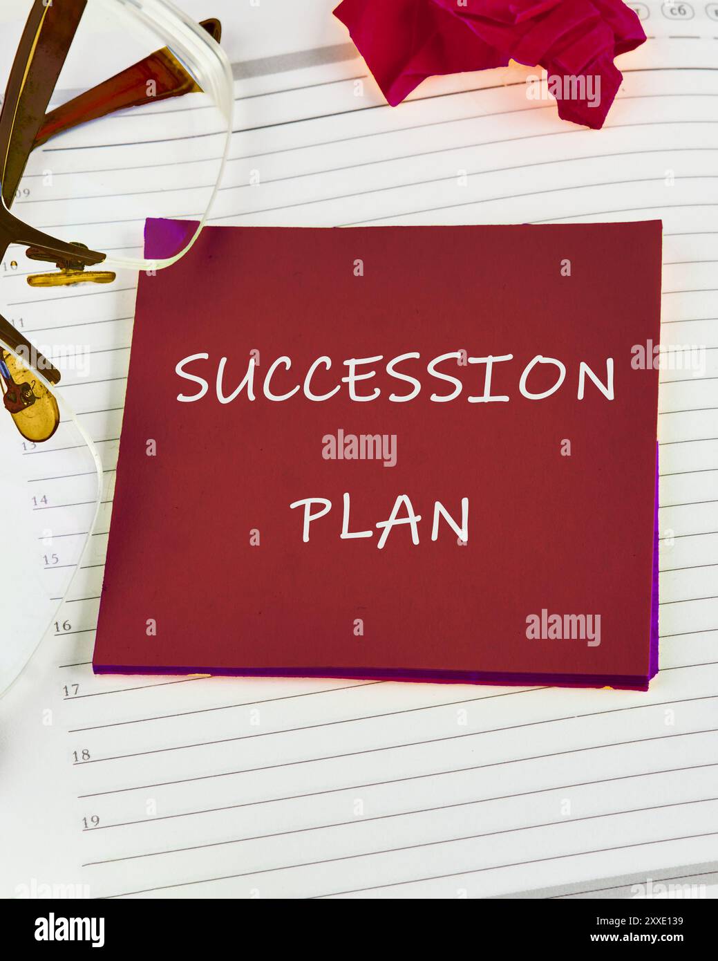 SUCCESSION PLAN word alphabet letters on a red sticker on a white ...