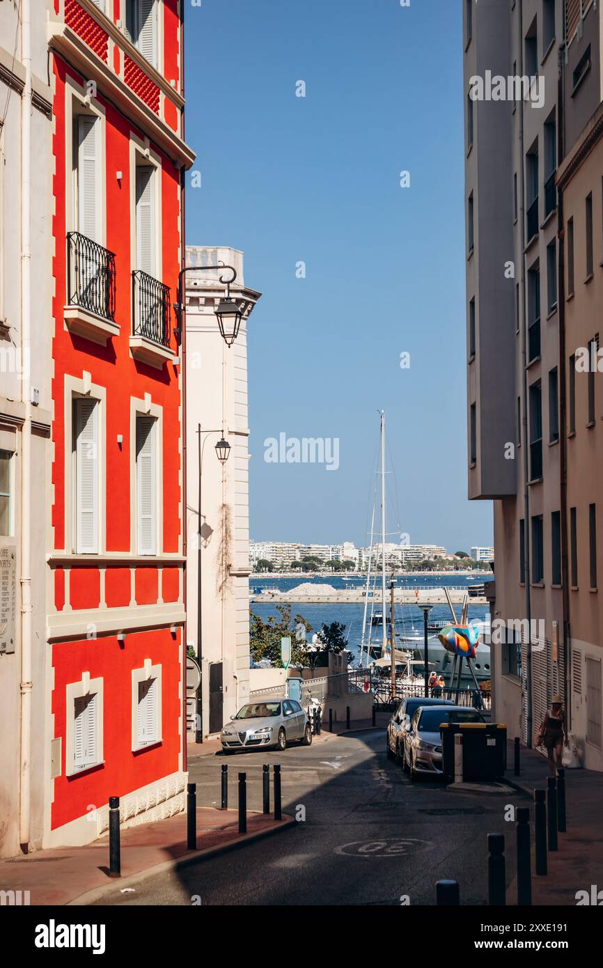 Cannes, France - August 1, 2024: A beautiful bright red building in the ...