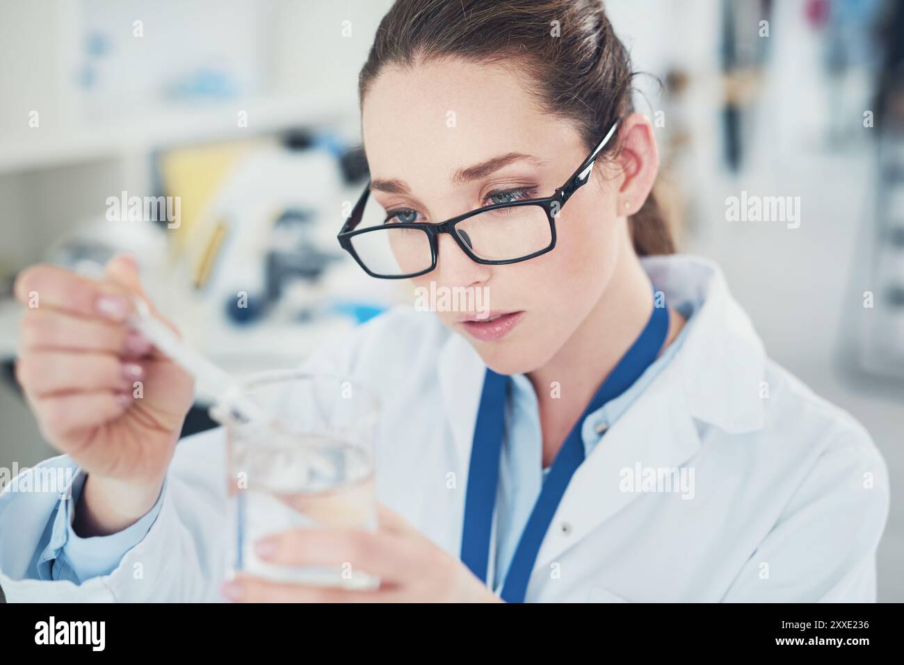 Pipette, scientist and sample in chemistry laboratory for medicine ...