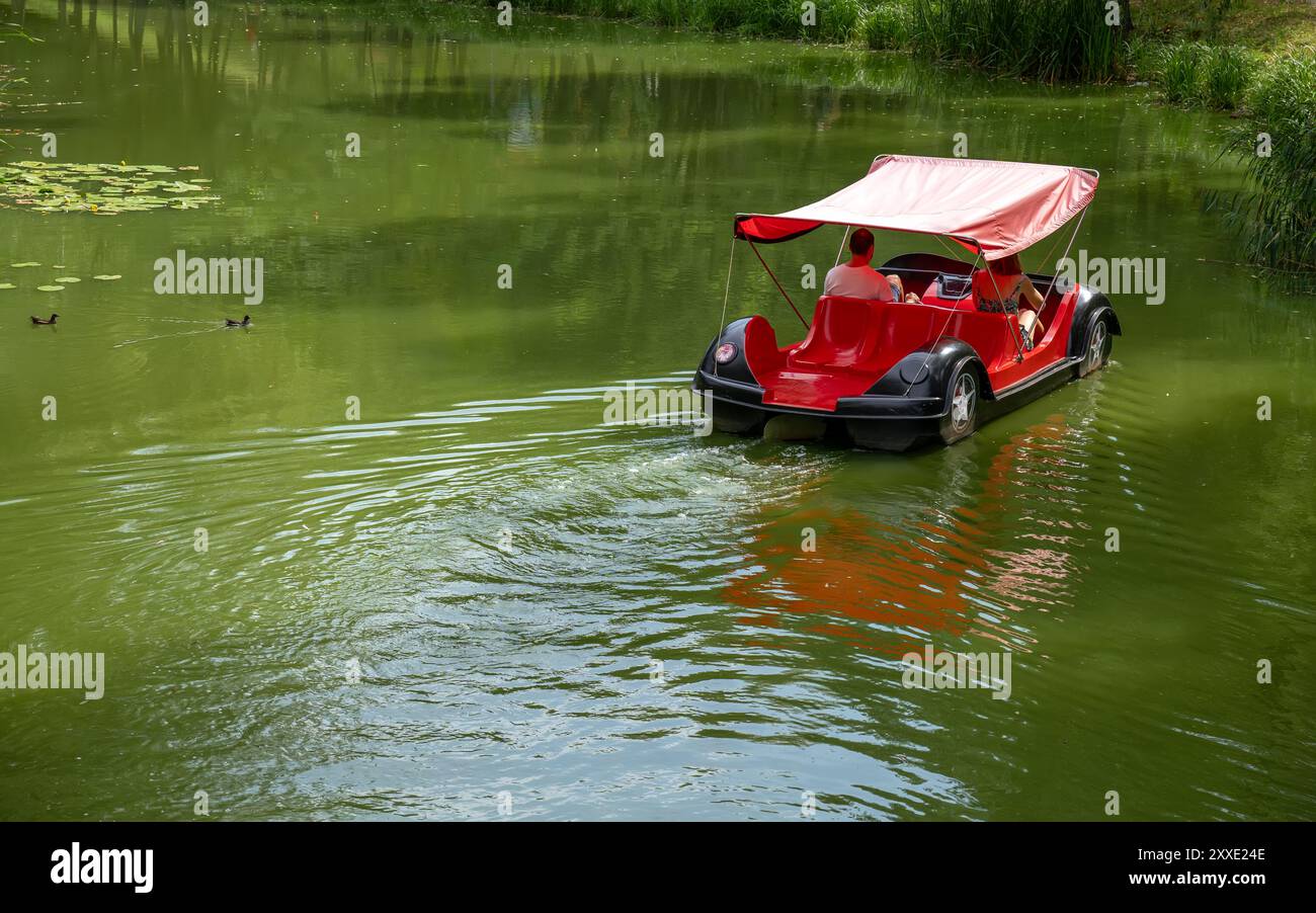 Family red boat river hi-res stock photography and images - Alamy