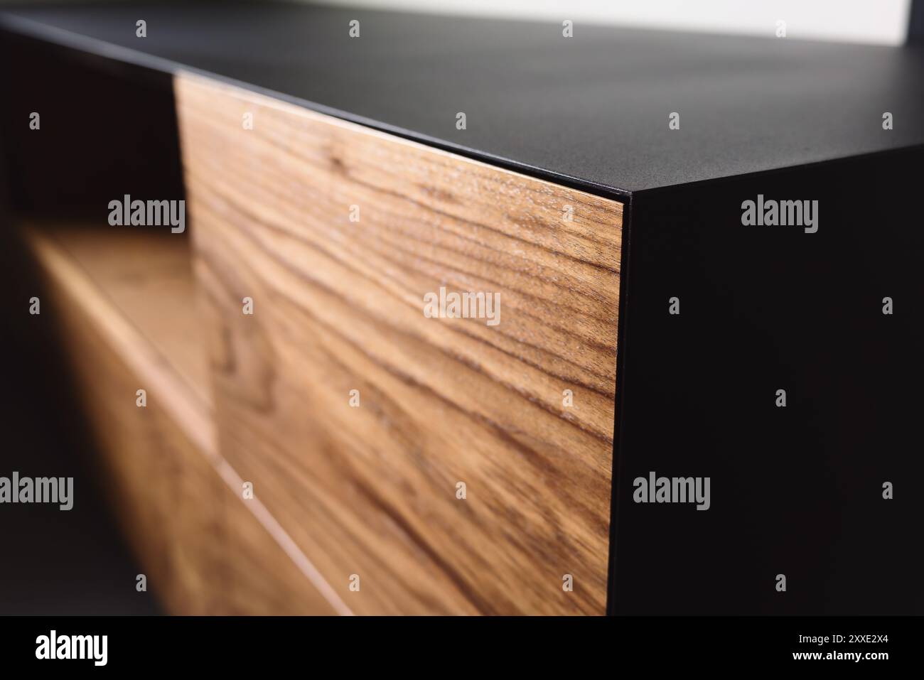 Closeup details of modern tv stand made from walnut and powder coated ...