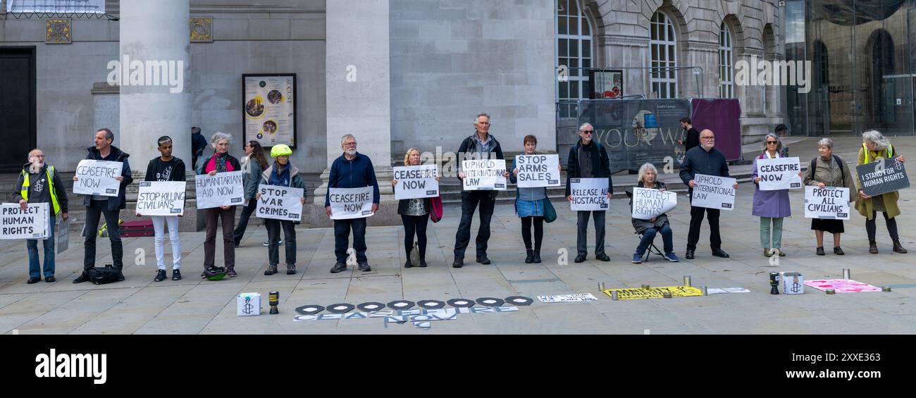 A group of Peace activists displaying various peace and anti war signs ...