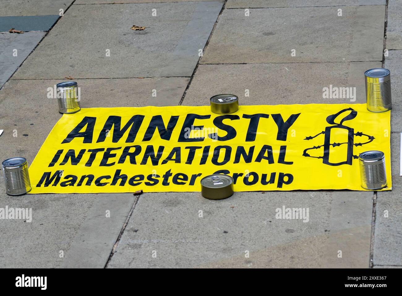 A group of Peace activists displaying various peace and anti war signs ...