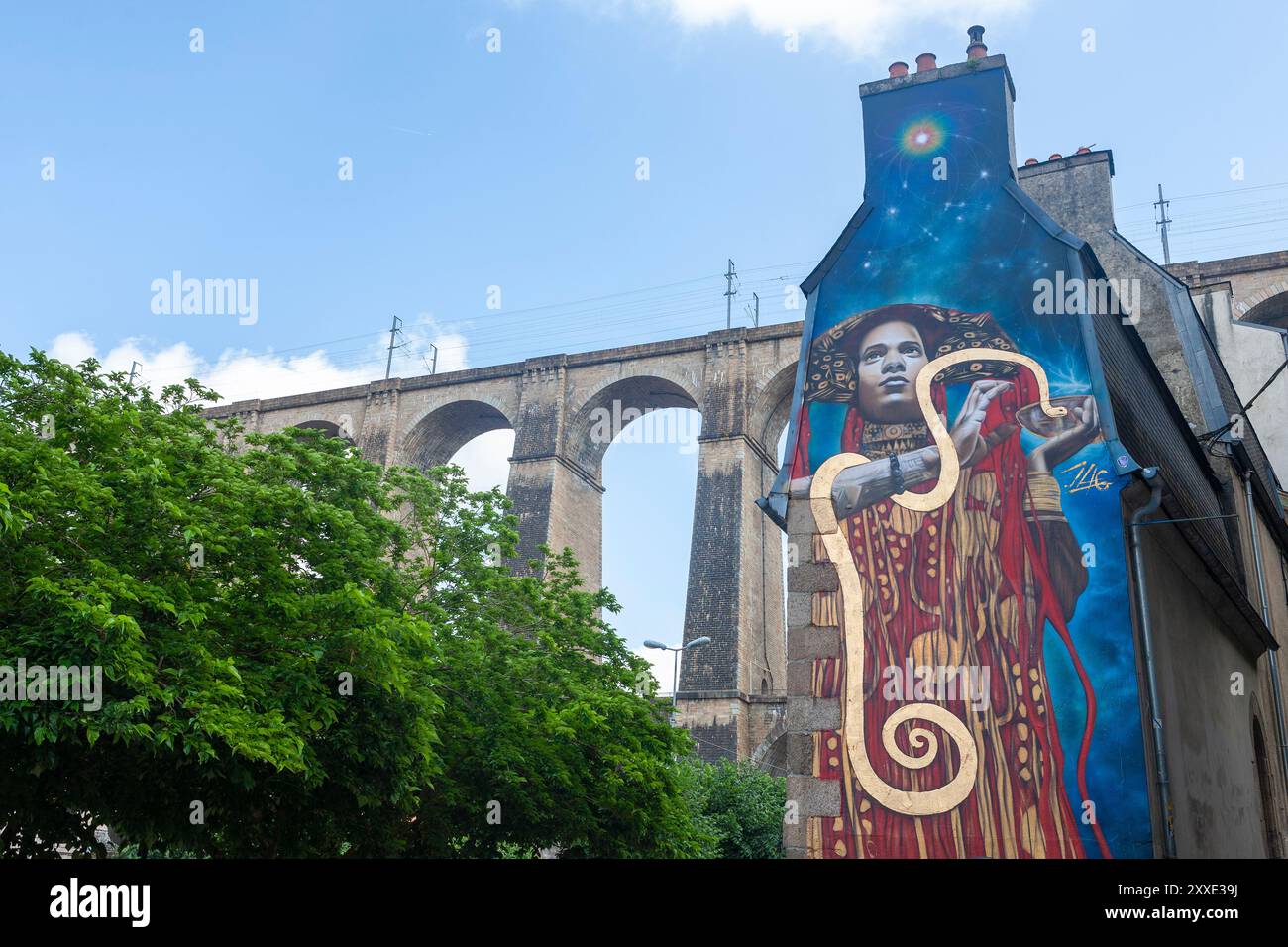 Huge mural on the side of a house, with the famous 19th century viaduct ...