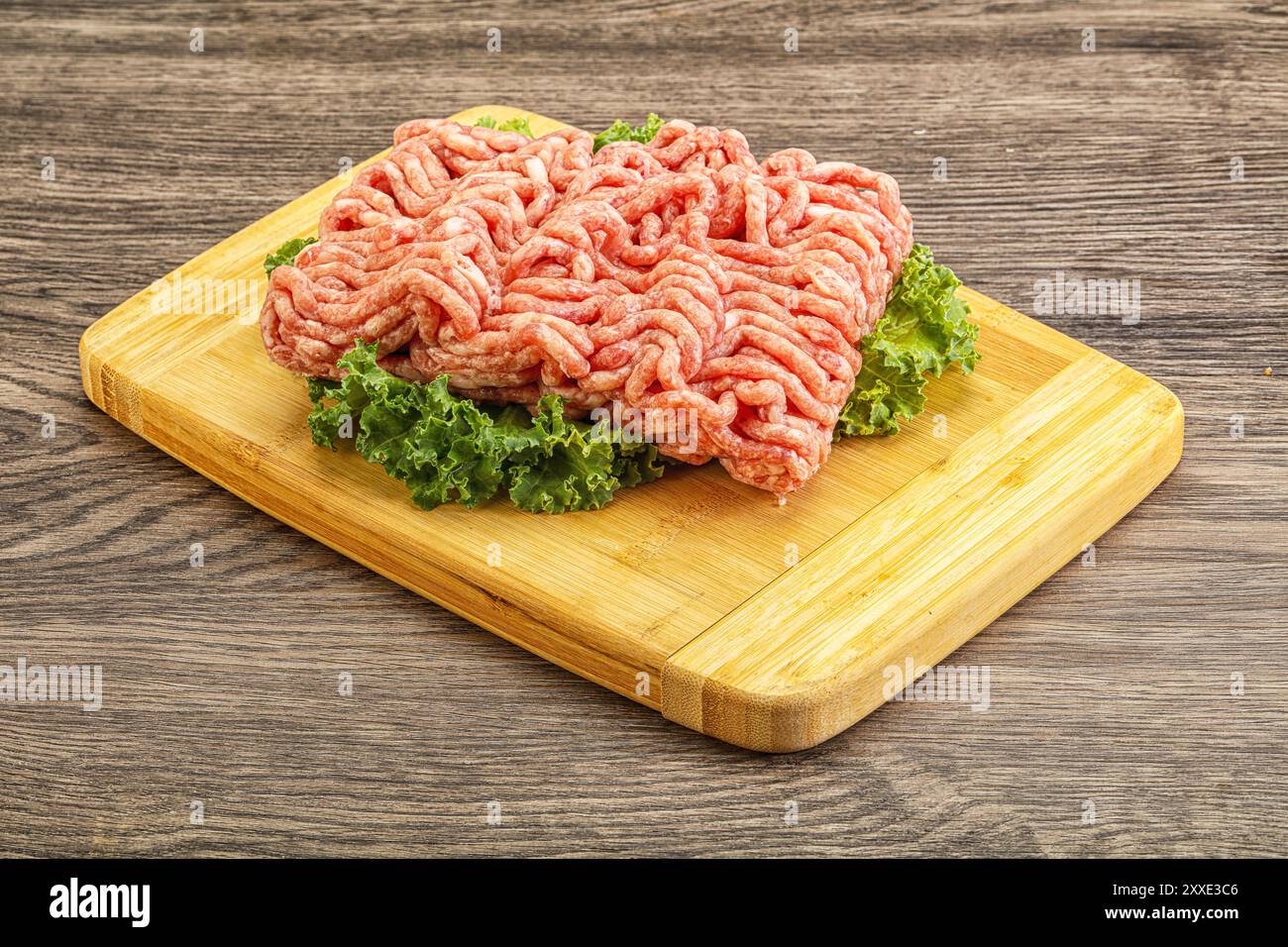 Raw pork minced meat over board for cooking Stock Photo - Alamy