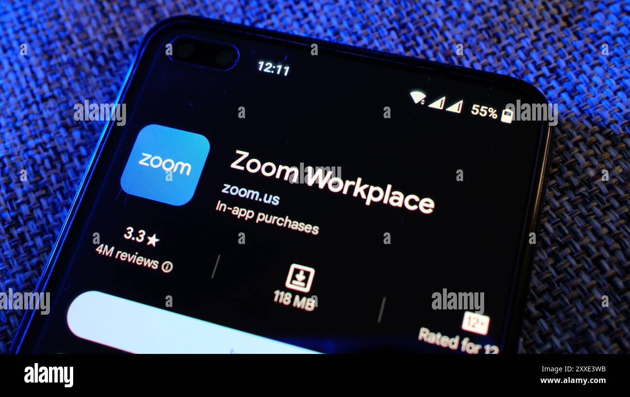 Zoom app in play store page on mobile phone display. London, UK, 08.24. ...