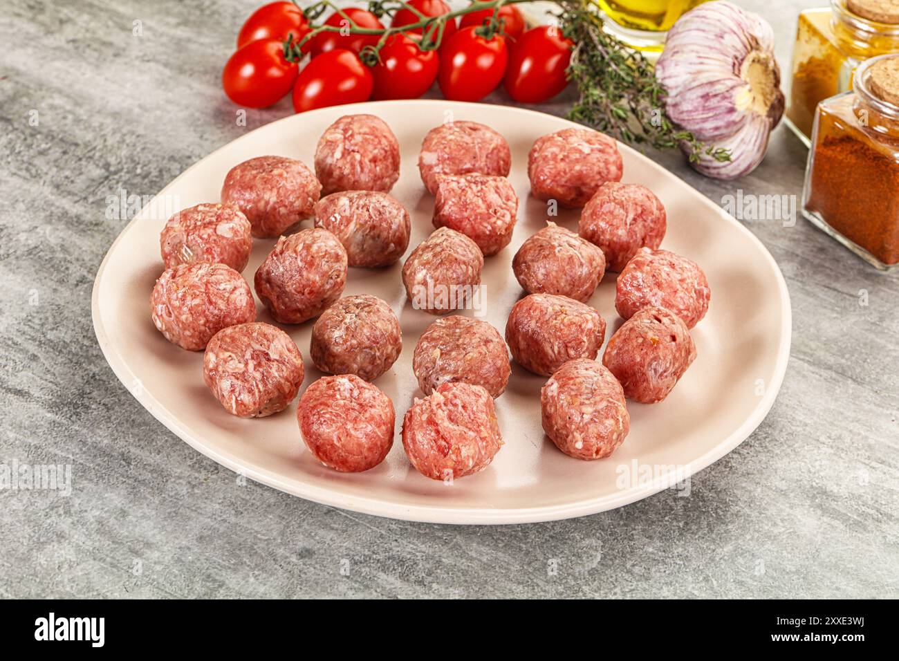 Uncooked raw beef meatball minced meat Stock Photo - Alamy