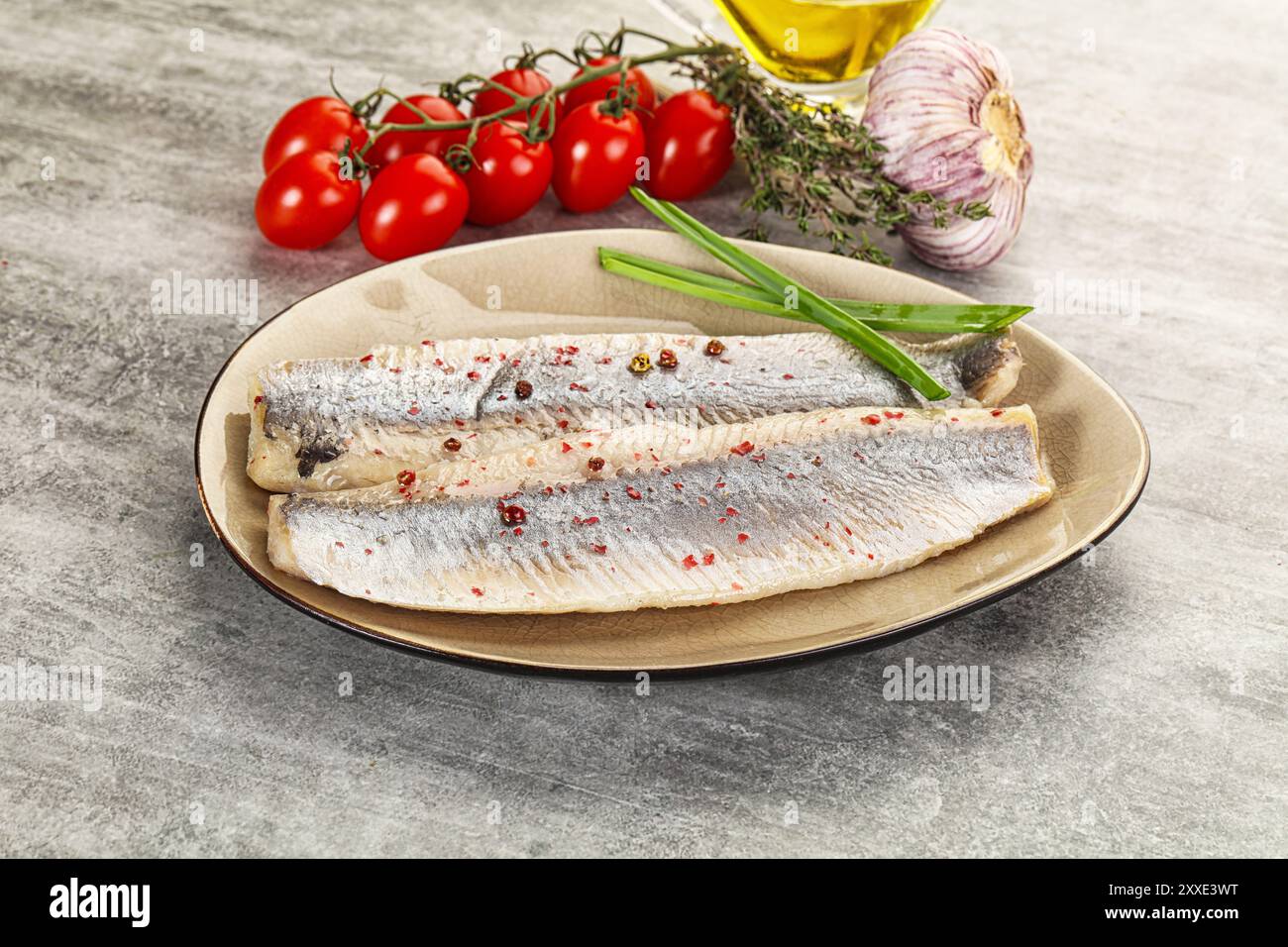 Marinated salted herring fillet with green onion Stock Photo - Alamy