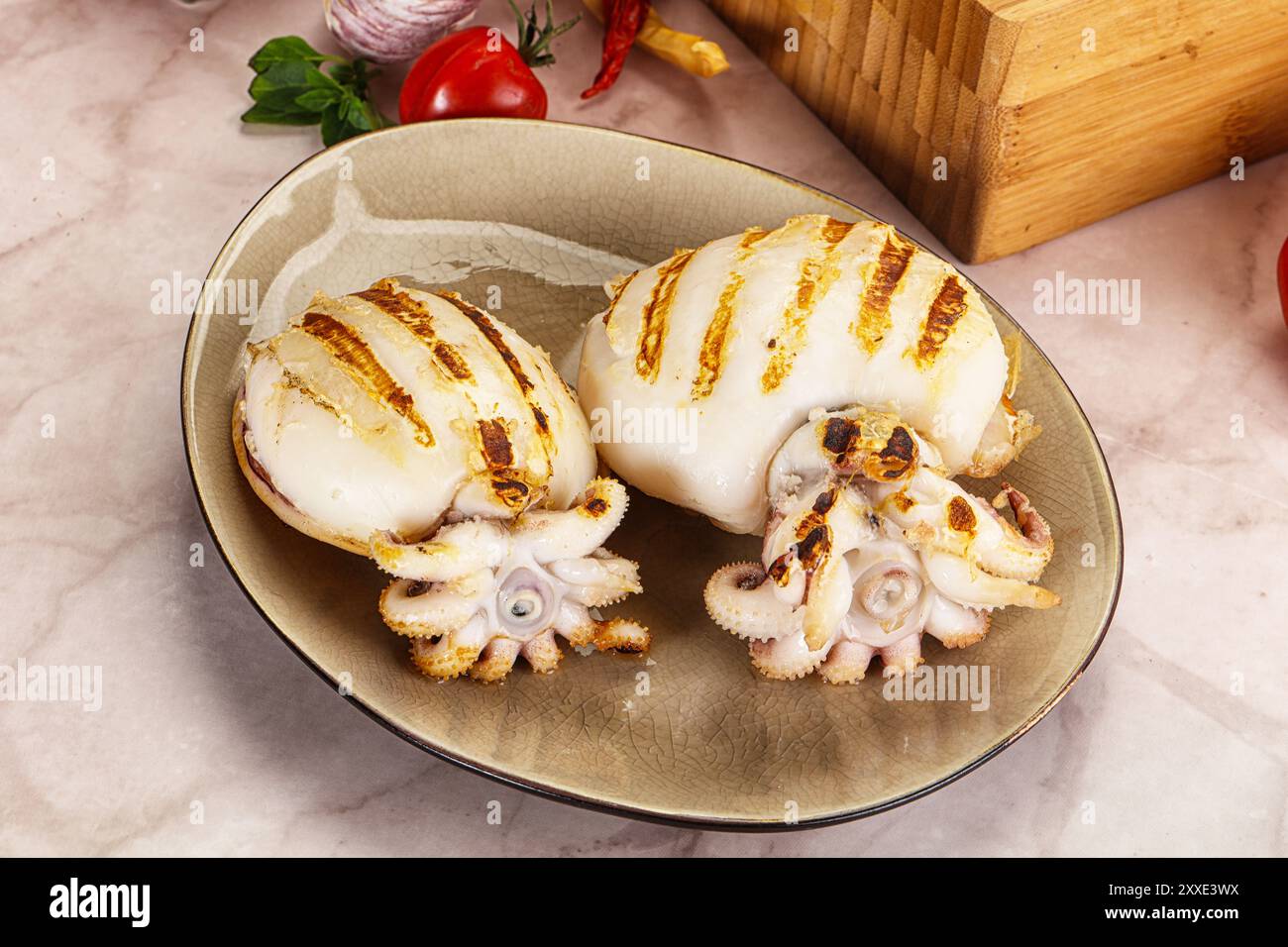 Grilled gourmet cuttlefish in the plate Stock Photo - Alamy