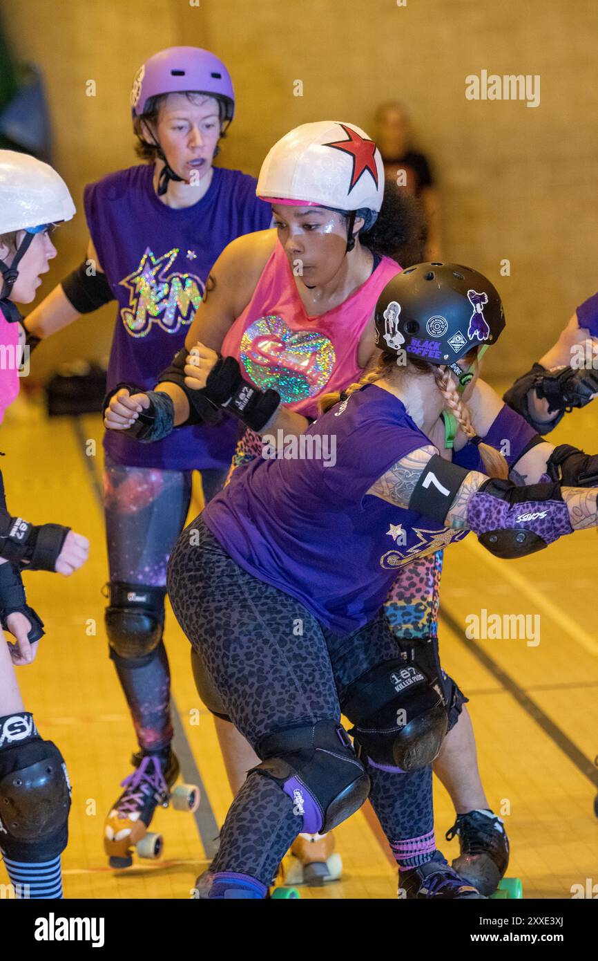 Active blocking during a roller derby bout between Jem and Sindy mixed ...