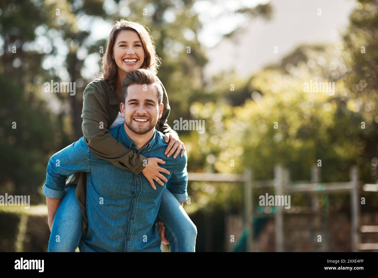 Couple, portrait and hug with piggyback outdoor for summer holiday ...