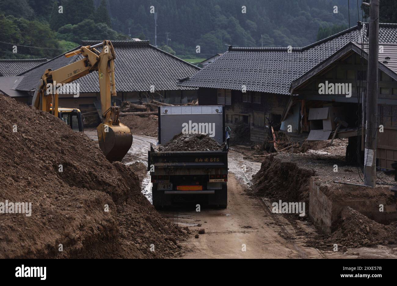 The removal operation of earth and sand from the streets and houses is ...