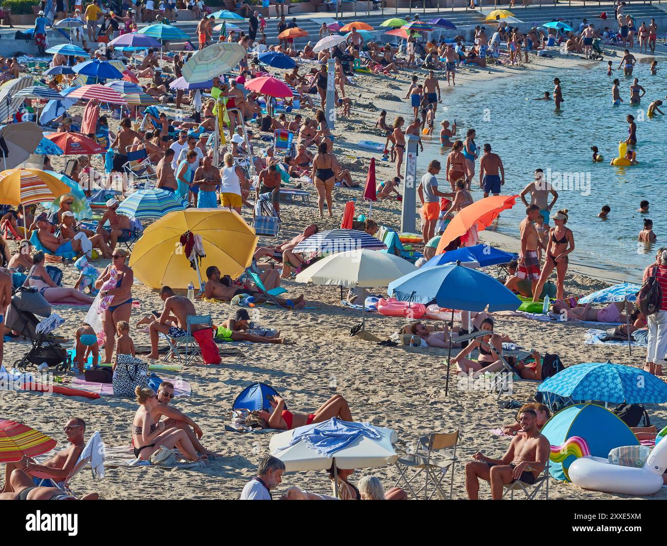 A typical sandy beach in August in Antibes,on the French Riviera, France Stock Photo - Alamy