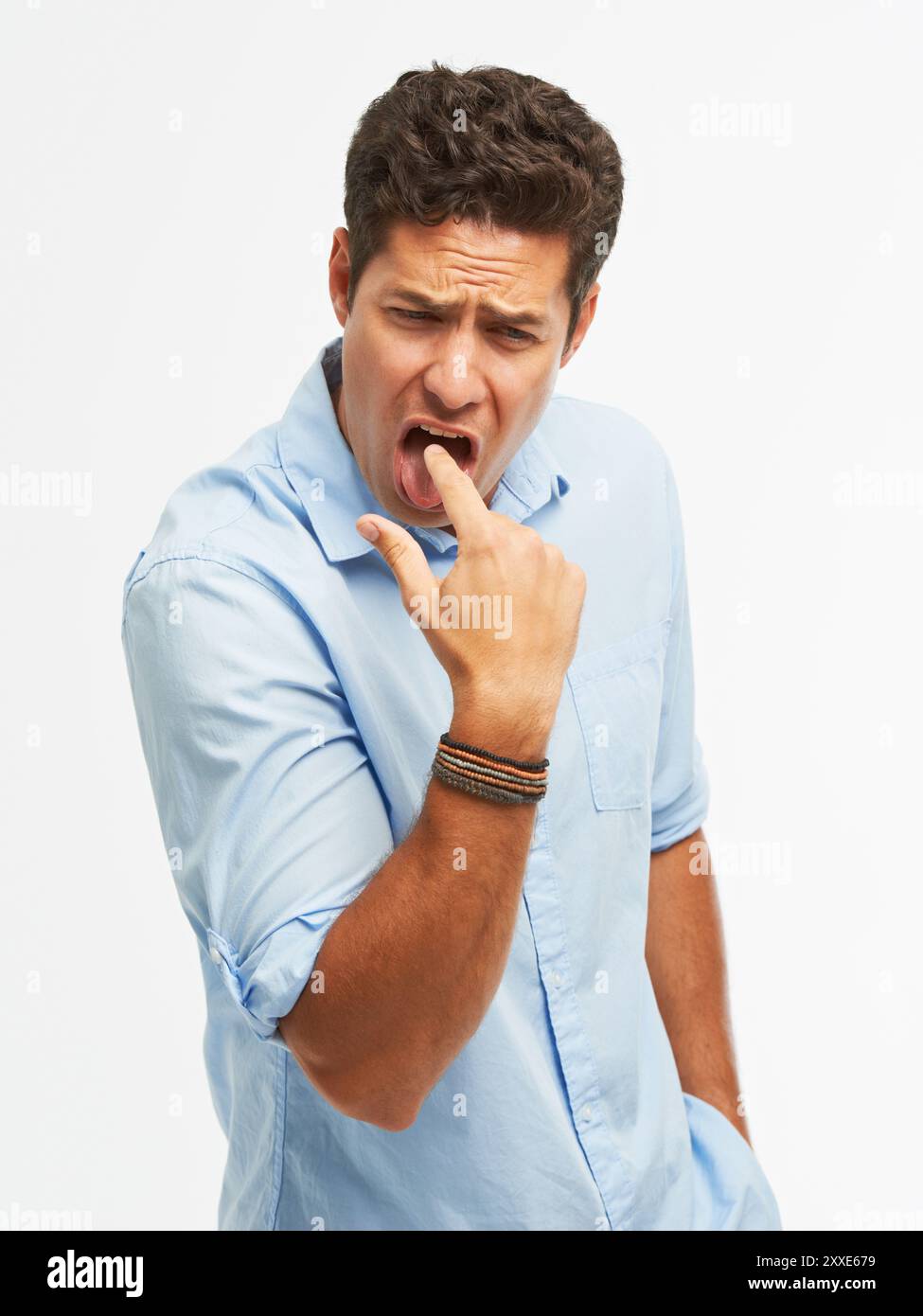 Man, finger and disgust expression in studio for negative, omg and wtf ...