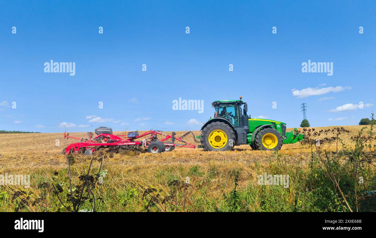 Arable farm, tractor preparing the land after harvest, August 2024, UK ...