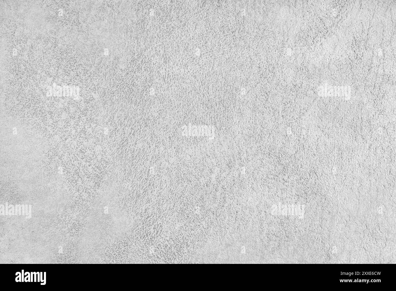 White suede leather texture with embossed pattern macro, close up ...