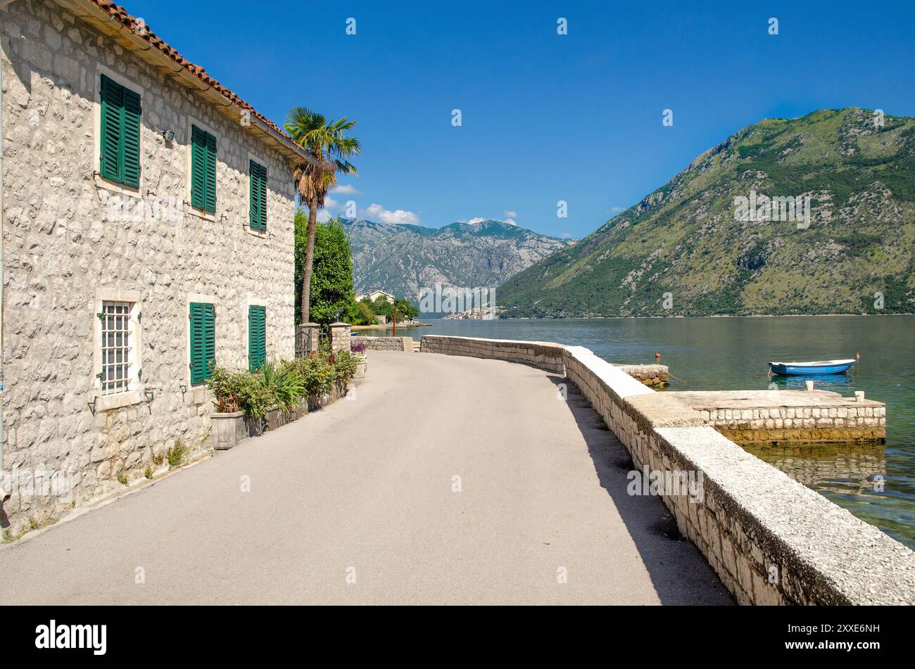 View along Stoliv village promenade with traditional stone houses ...