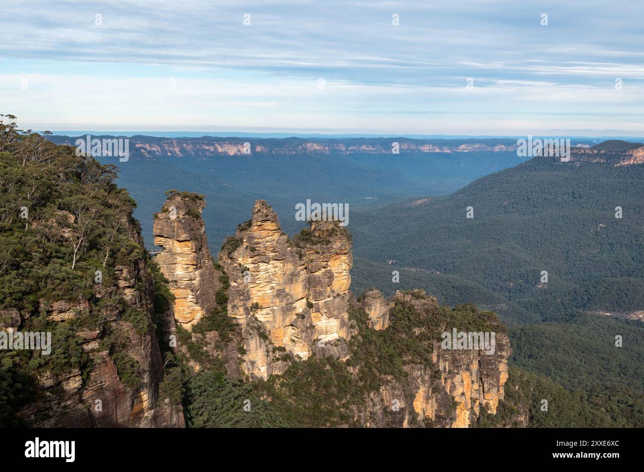 The famous three finger-shaped peaks are known as The Three Sisters ...