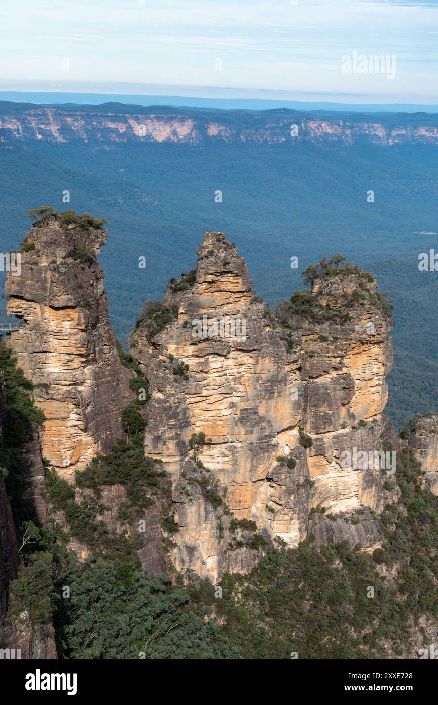 The famous three finger-shaped peaks are known as The Three Sisters ...