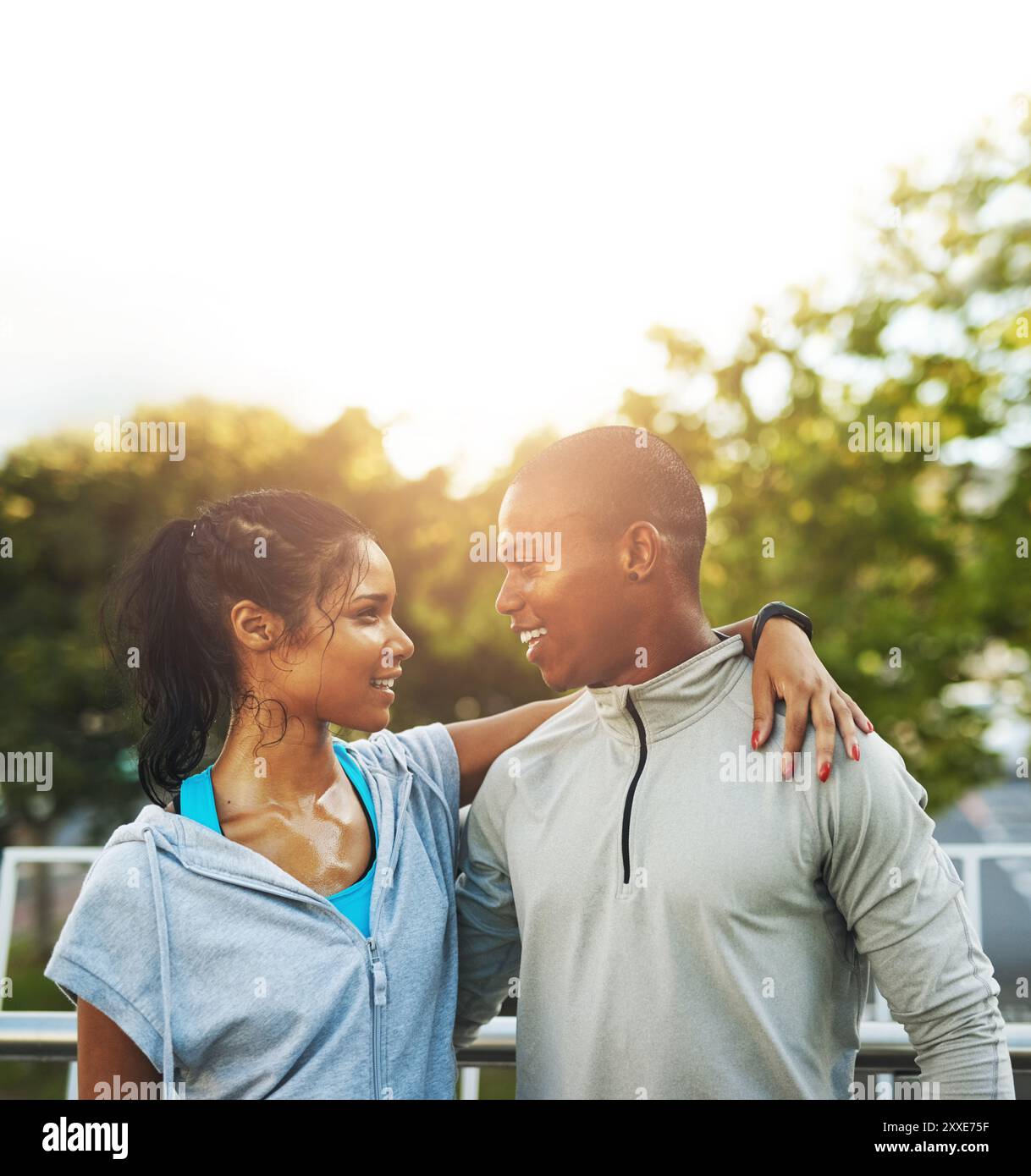 Outdoor, couple and happy for fitness with hug on running break for ...