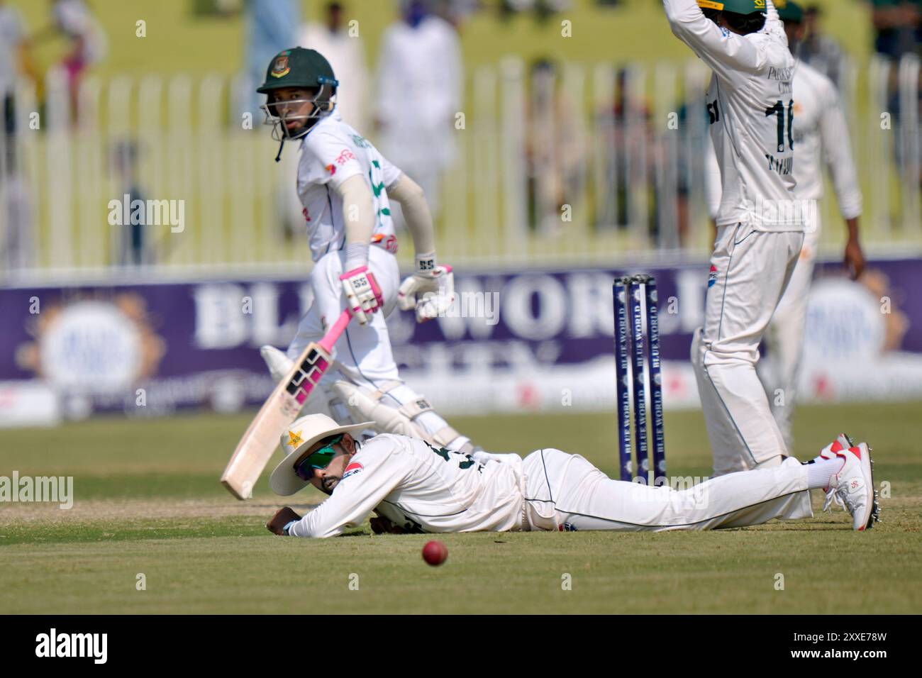 Pakistan's Babar Azam, bottom, reacts after dropping a catch of ...