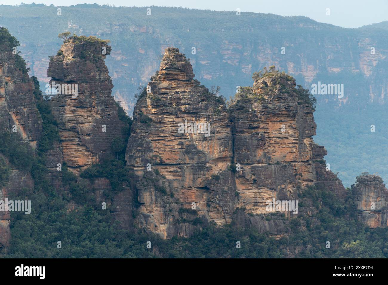 The famous three finger-shaped peaks are known as The Three Sisters ...