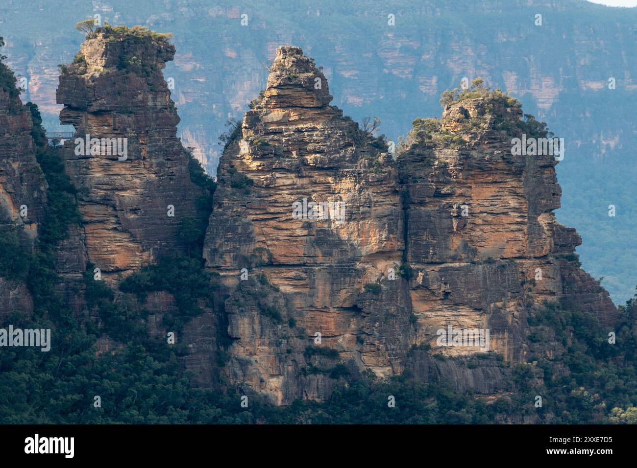 The famous three finger-shaped peaks are known as The Three Sisters ...