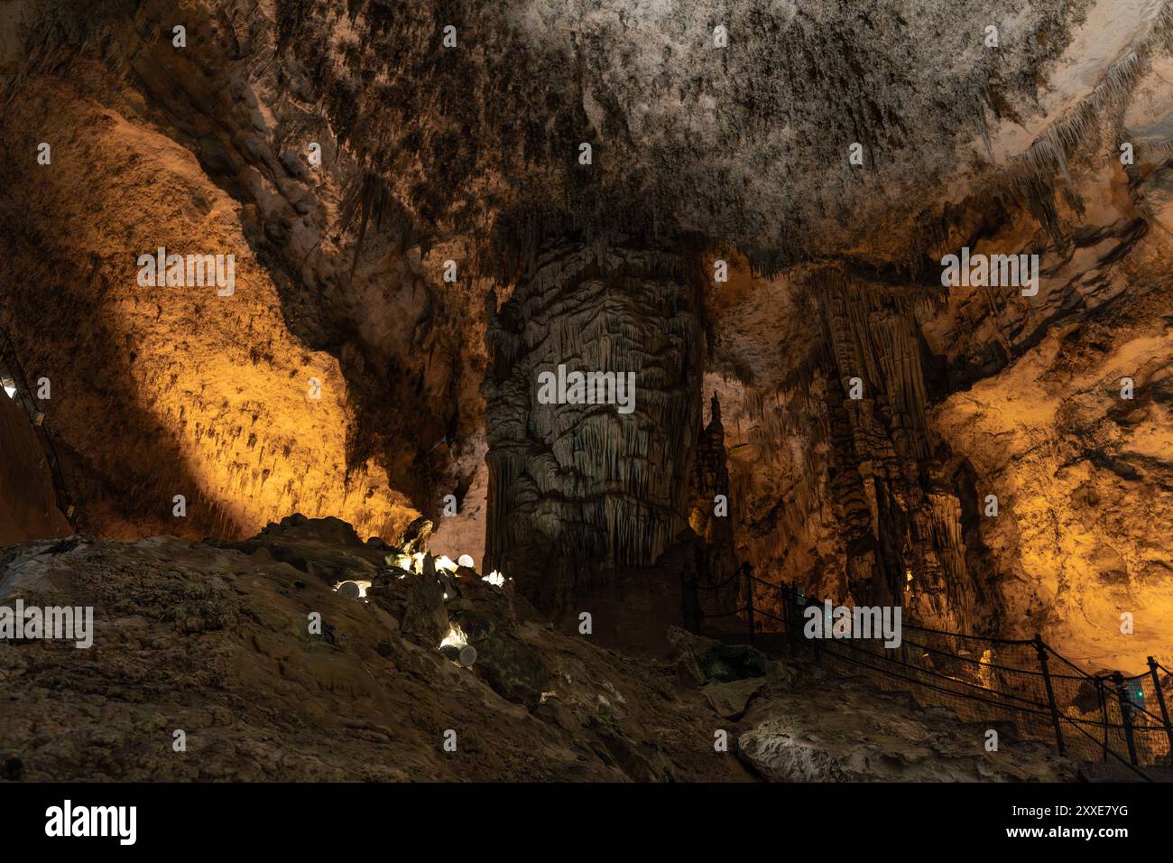 Large cave with a huge column and stalactites on the ceiling of the ...