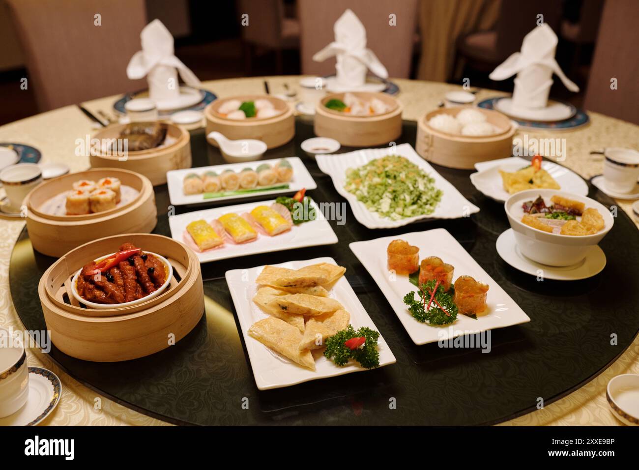 Round Table With Various Dishes Stock Photo - Alamy