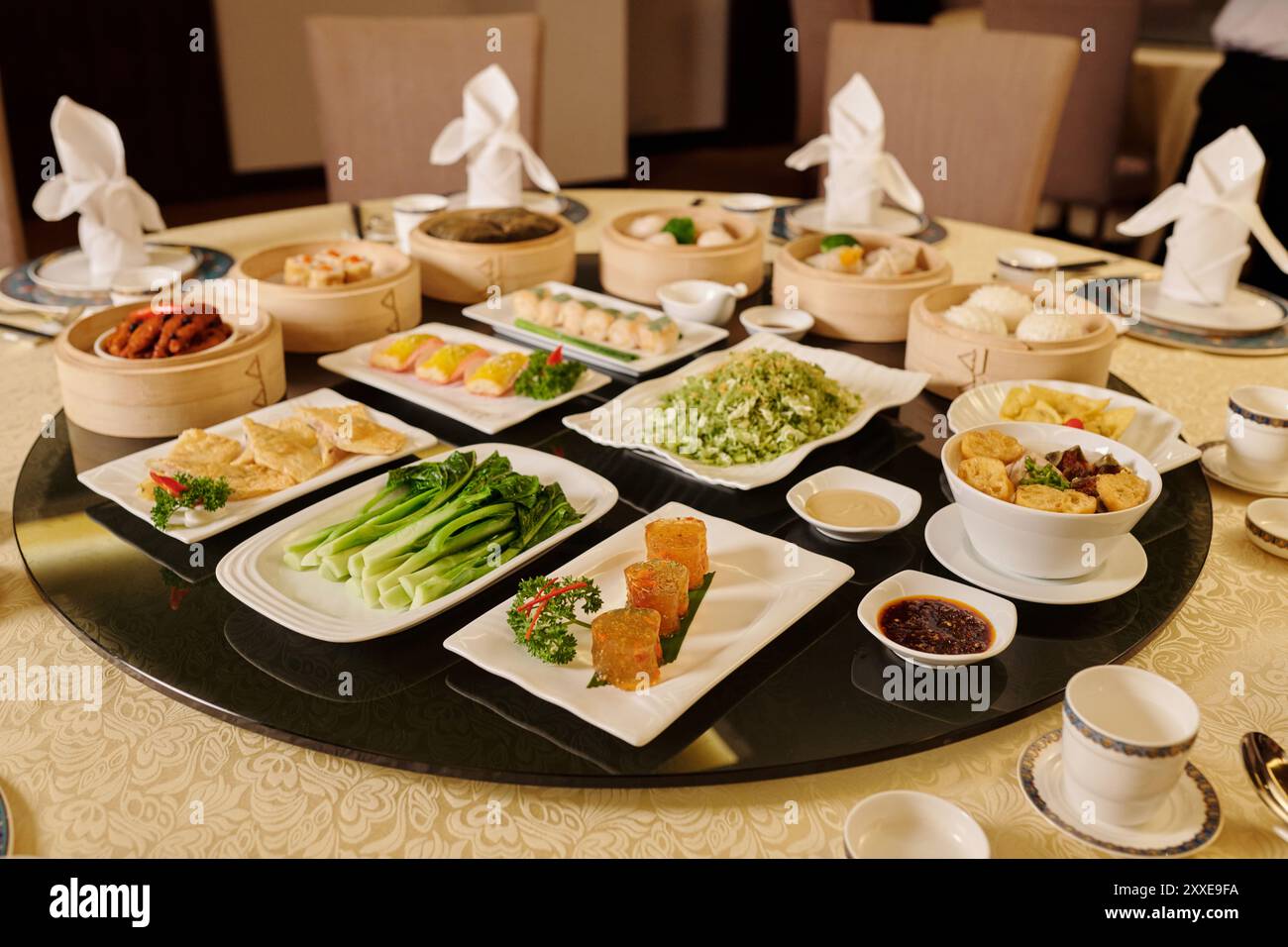Various Dishes Serving On Round Table In The Restaurant Stock Photo - Alamy