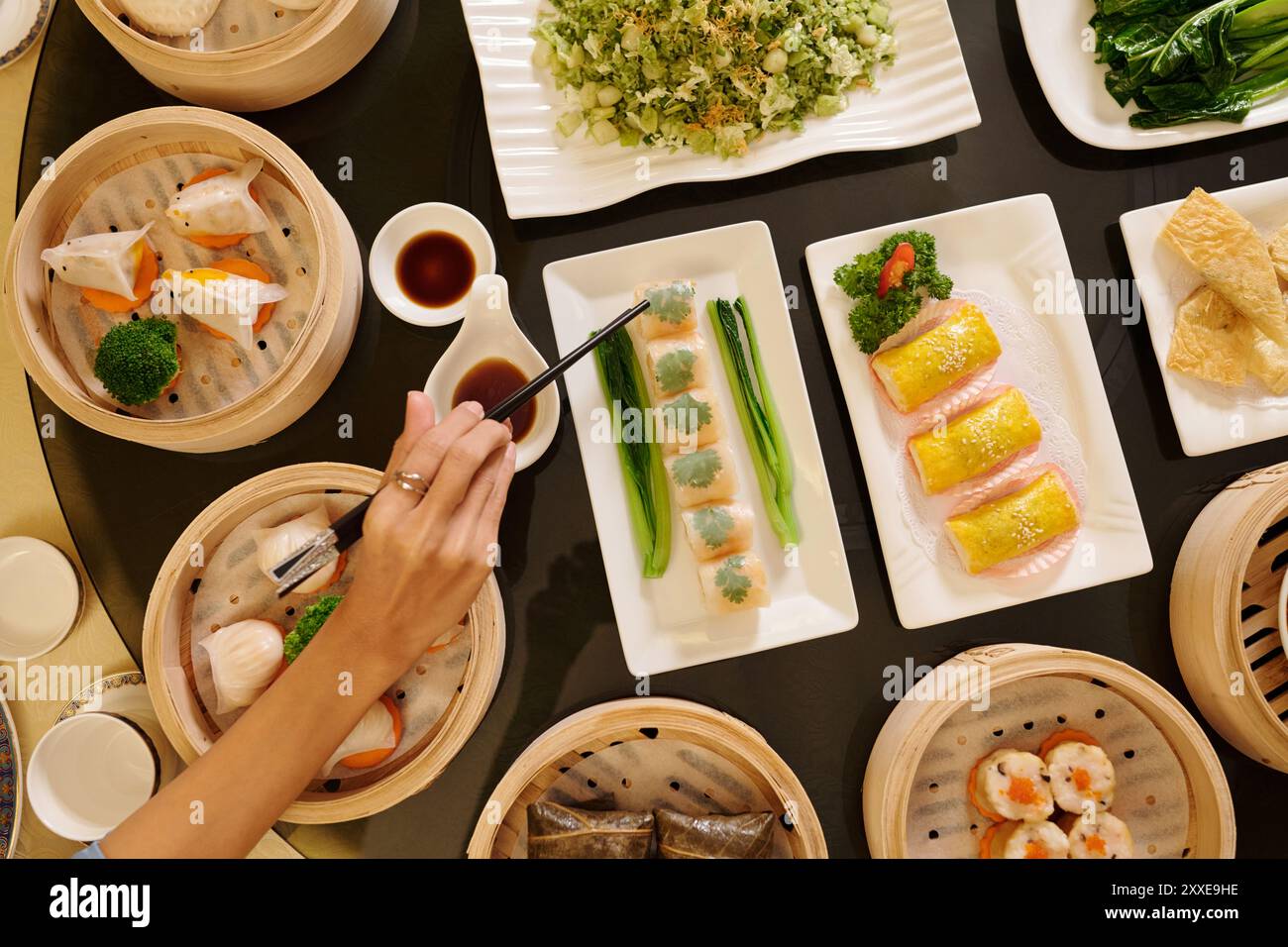 Woman Eating Rolls In The Restaurant Stock Photo - Alamy
