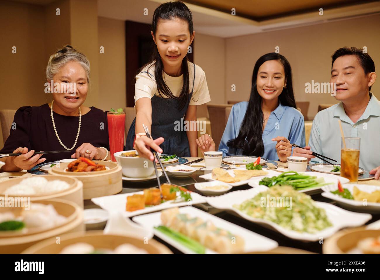 Family Eating Rolls In The Restaurant Stock Photo - Alamy