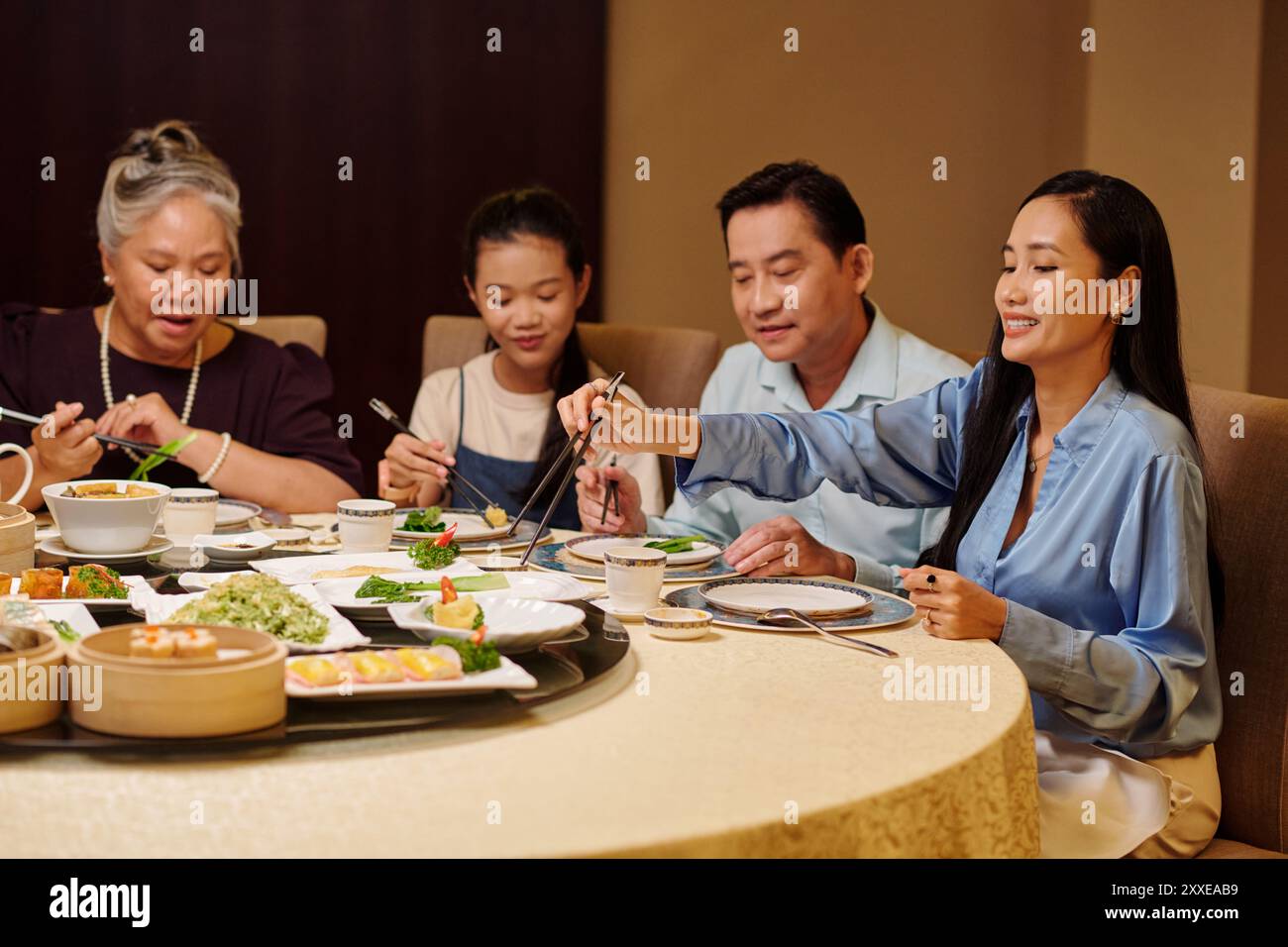 Family Eating Together In The Restaurant Stock Photo - Alamy