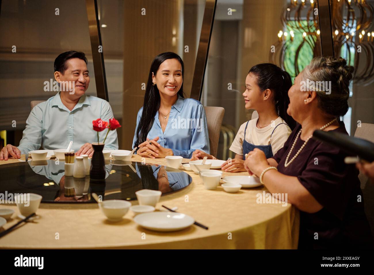 Family Gathering Together In The Restaurant Stock Photo - Alamy