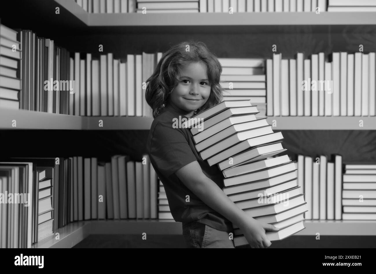 Back to school. Schoolboy reading book in library. Kids development ...