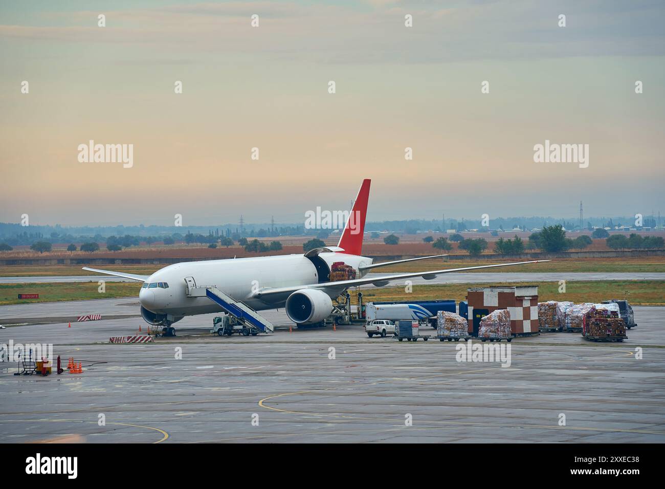 loading a cargo plane at the airport Stock Photo - Alamy