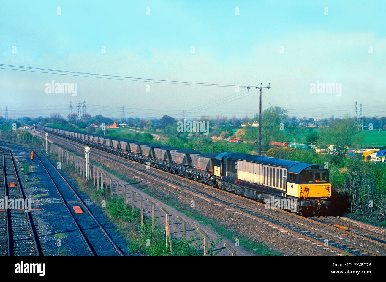 A Class 58 diesel locomotive number 58013 heads north towards Stenson ...