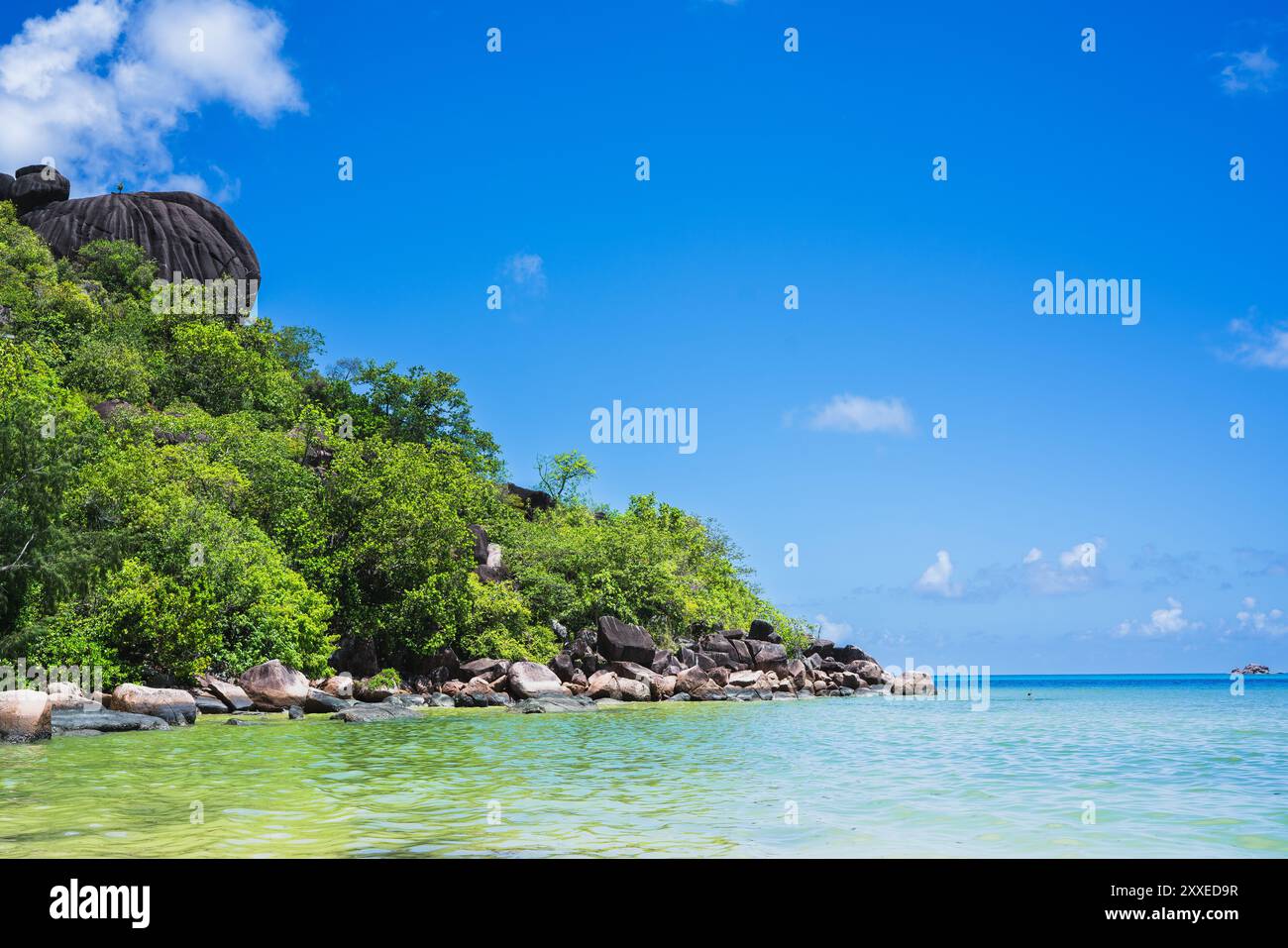 The rocky jungle coast of the Seychelles island of Praslin Stock Photo ...