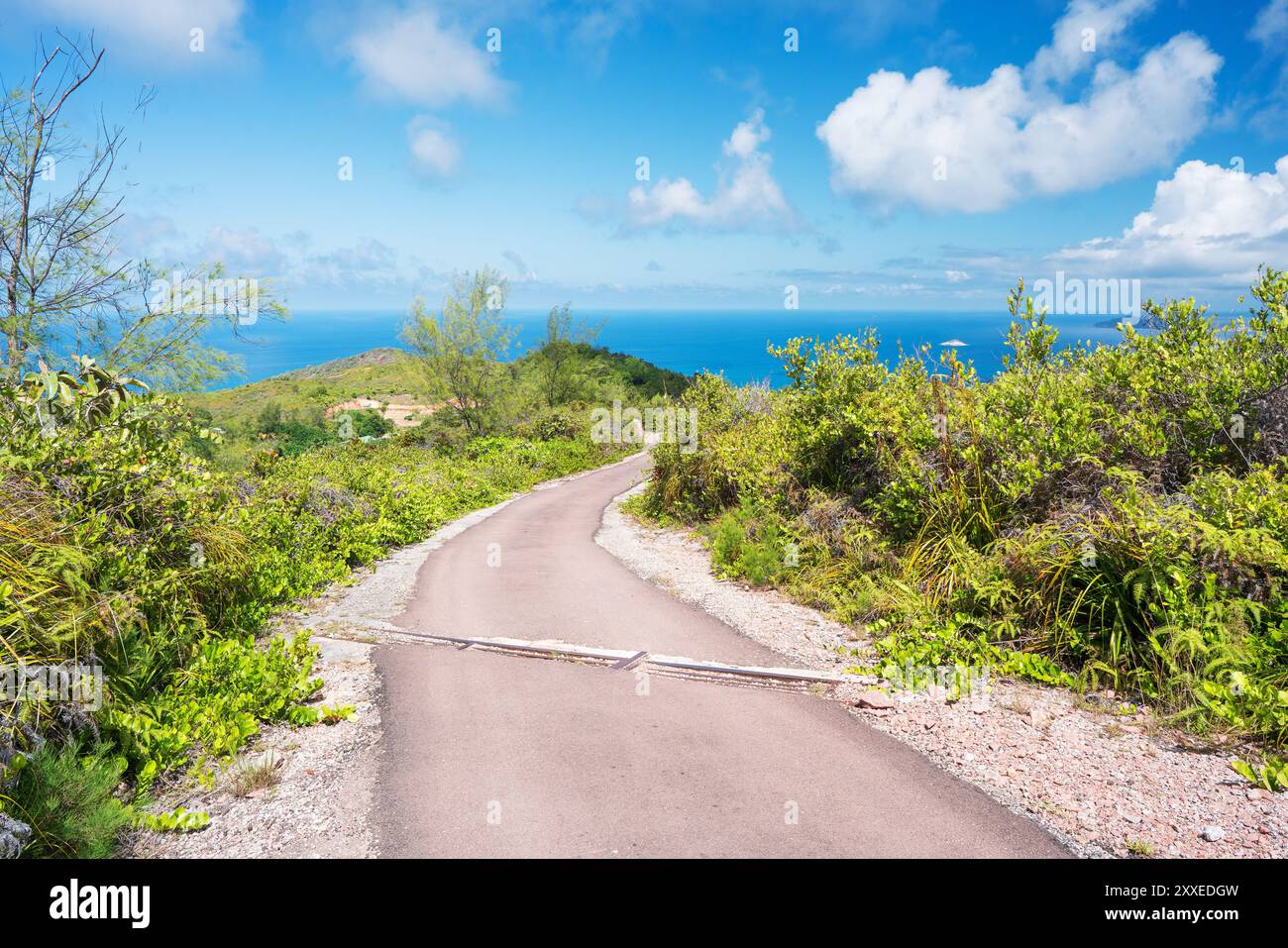 Road through the hills of the Seychelles island of Praslin Stock Photo ...