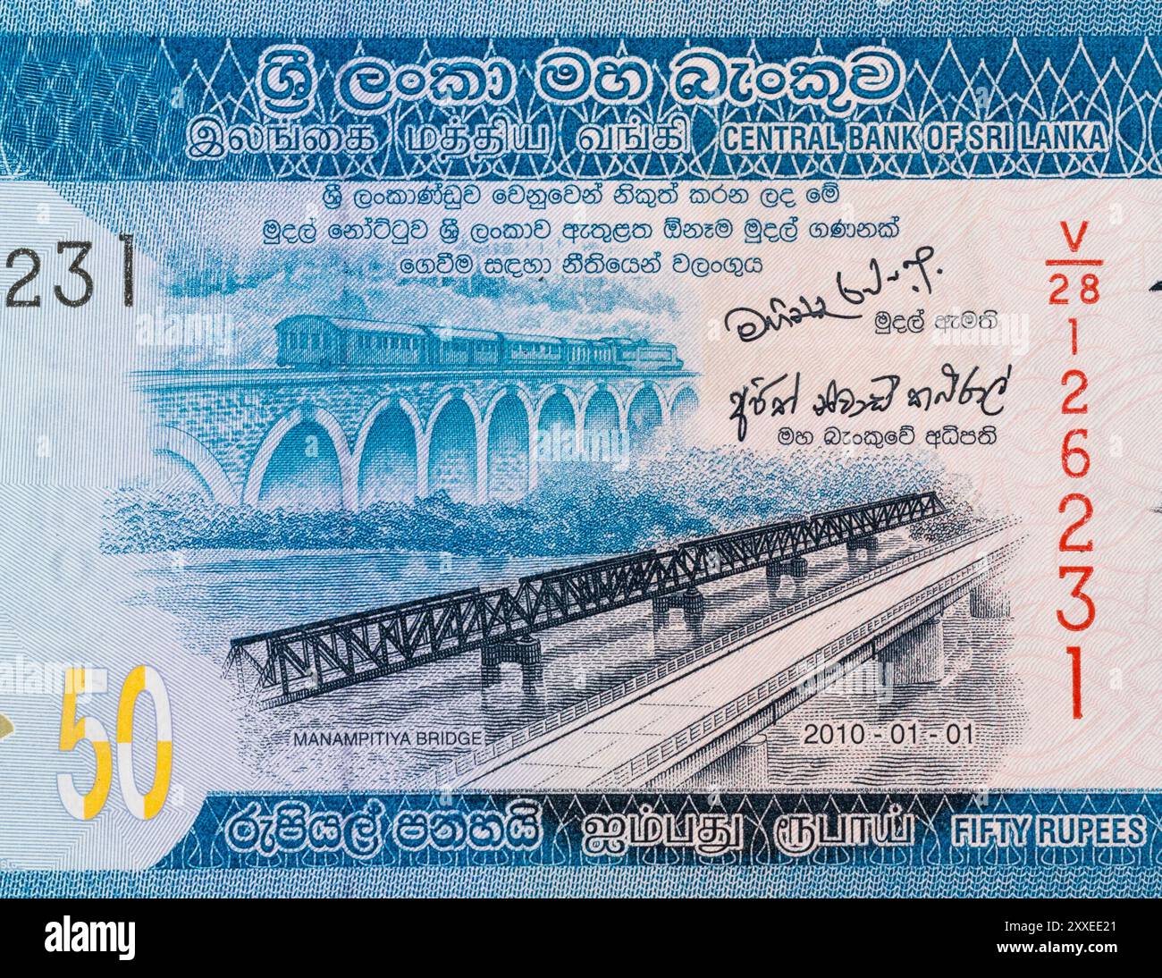 Portrait of newly constructed bridge at Manampitiya alongside the old ...